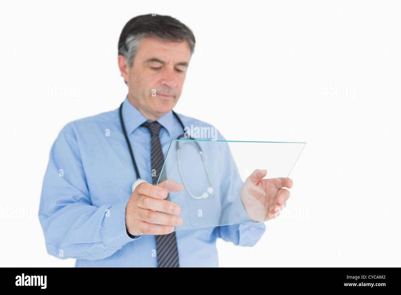 Doctor studying clear pane Stock Photo - Alamy