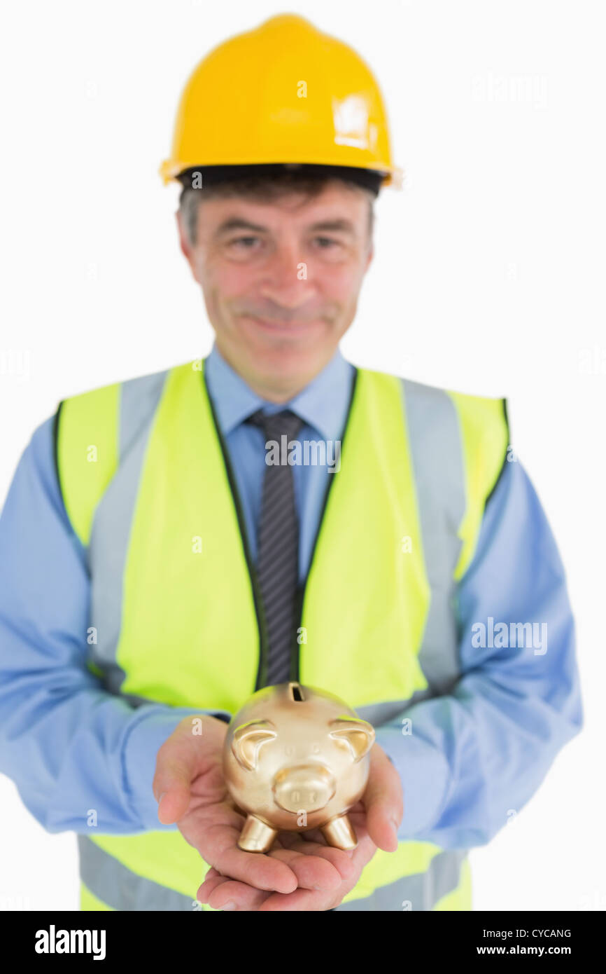 Architect holding a piggy bank Stock Photo - Alamy Architect holding a piggy bank Stock Photo - Alamy