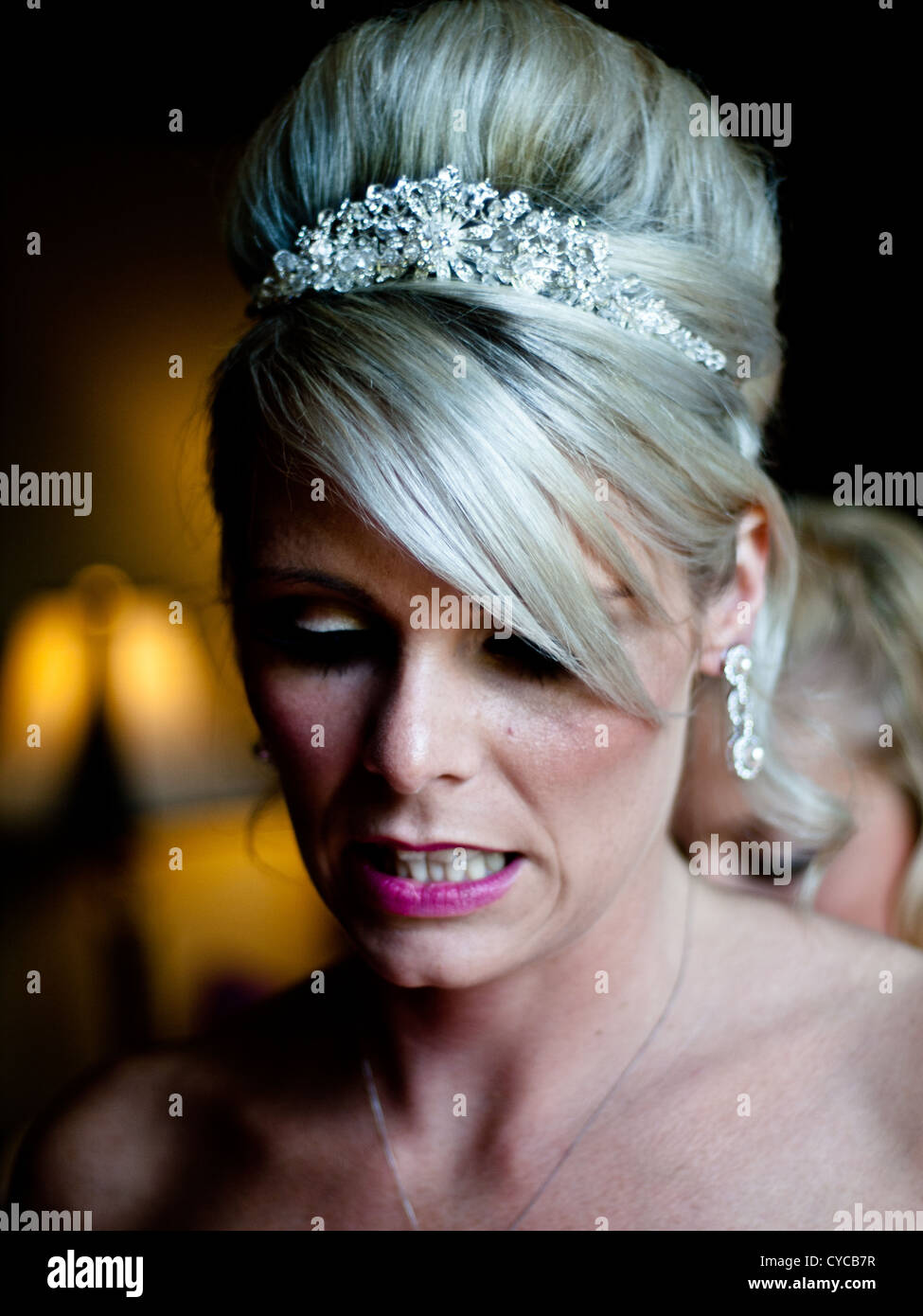 A nervous looking bride prepares for her wedding day Stock Photo - Alamy