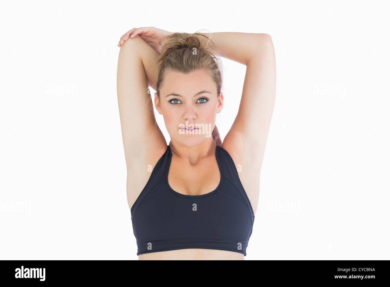 Woman standing stretching her arms Stock Photo - Alamy