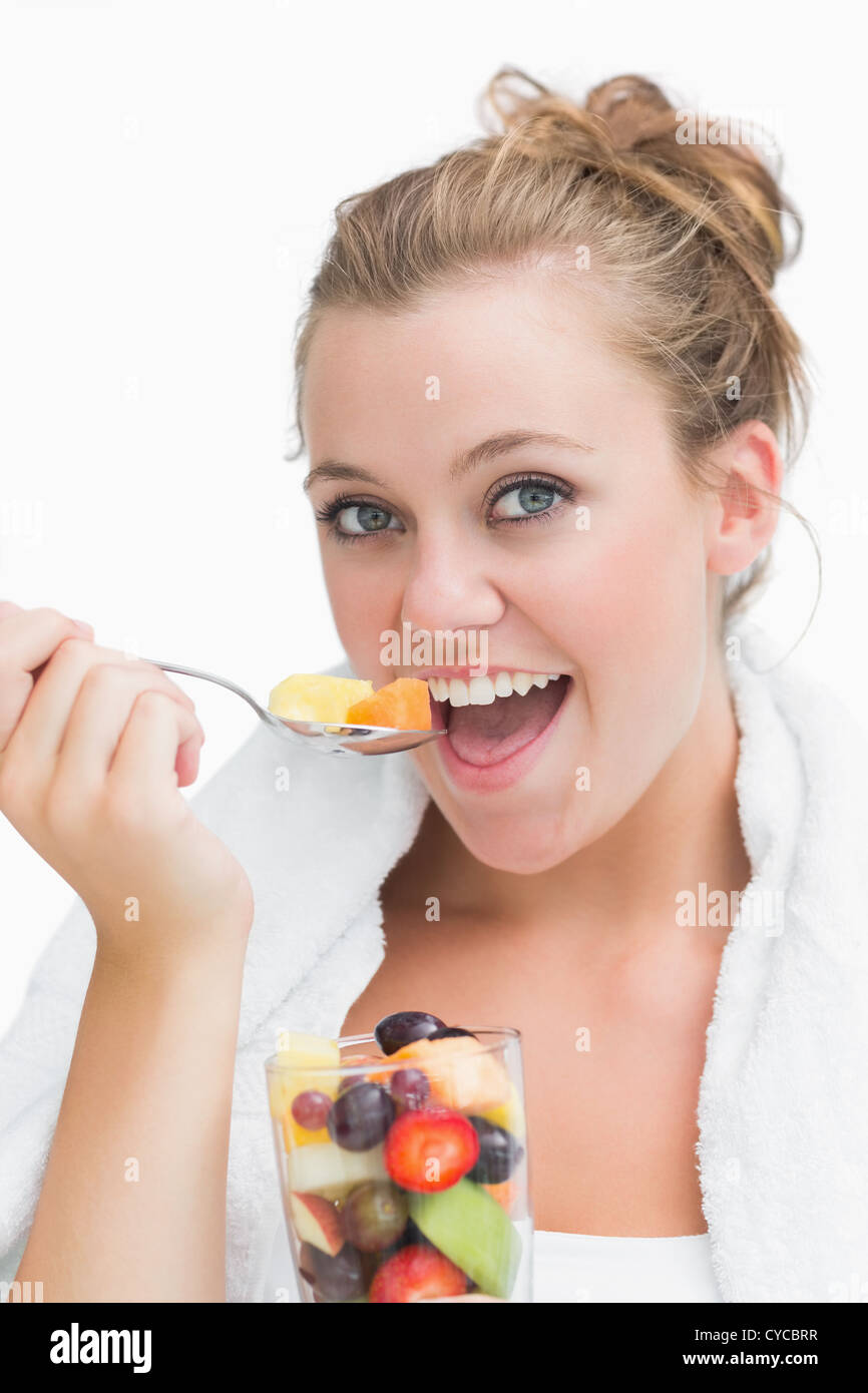 Woman eating fruit Stock Photo - Alamy
