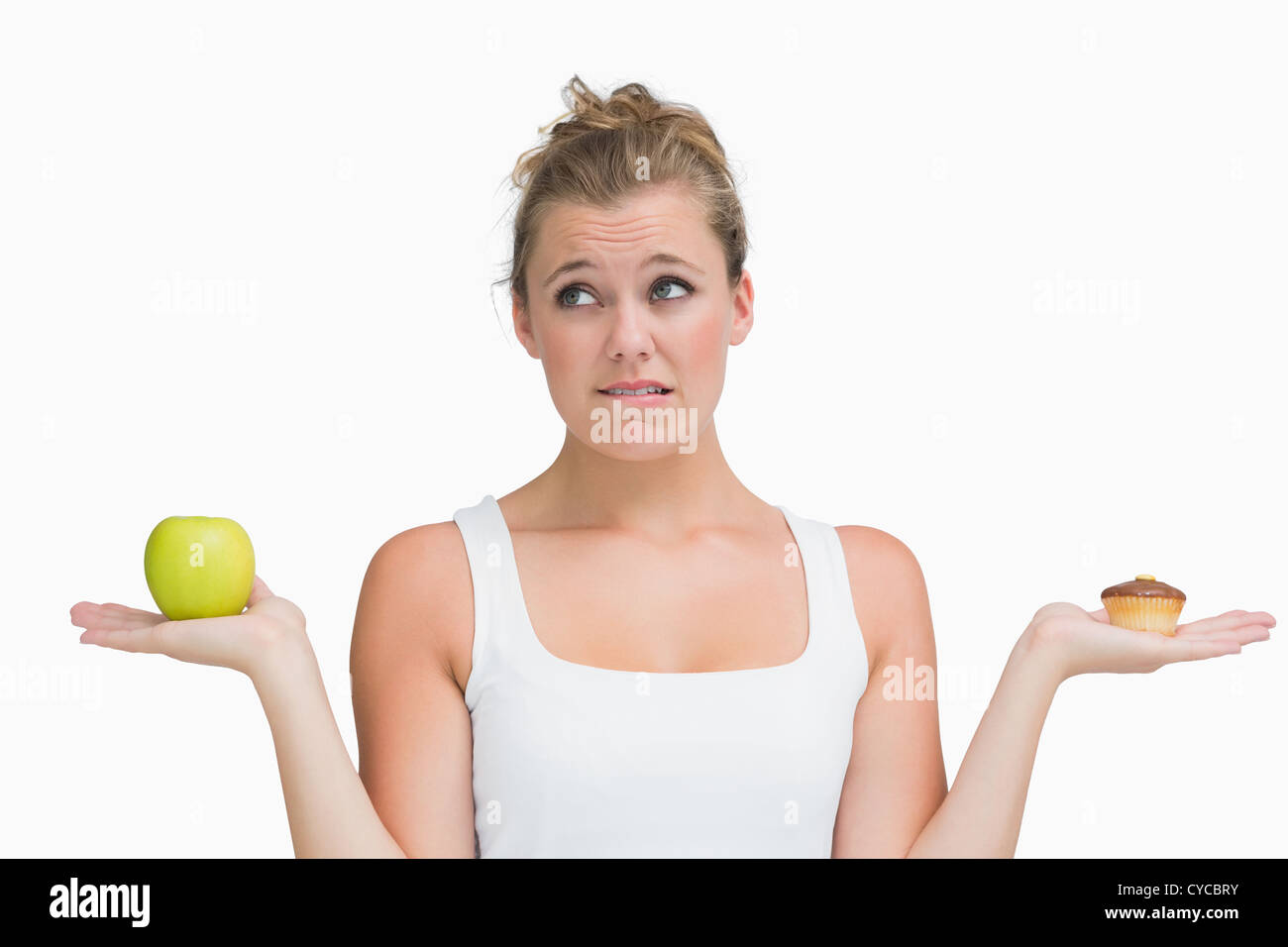 Woman deciding to eat healthy or not Stock Photo - Alamy