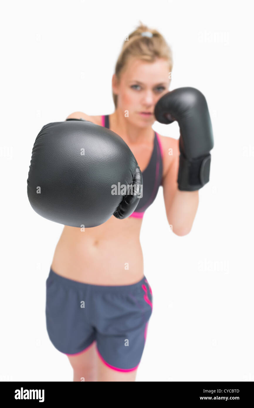 Female boxer stretching arm out Stock Photo - Alamy
