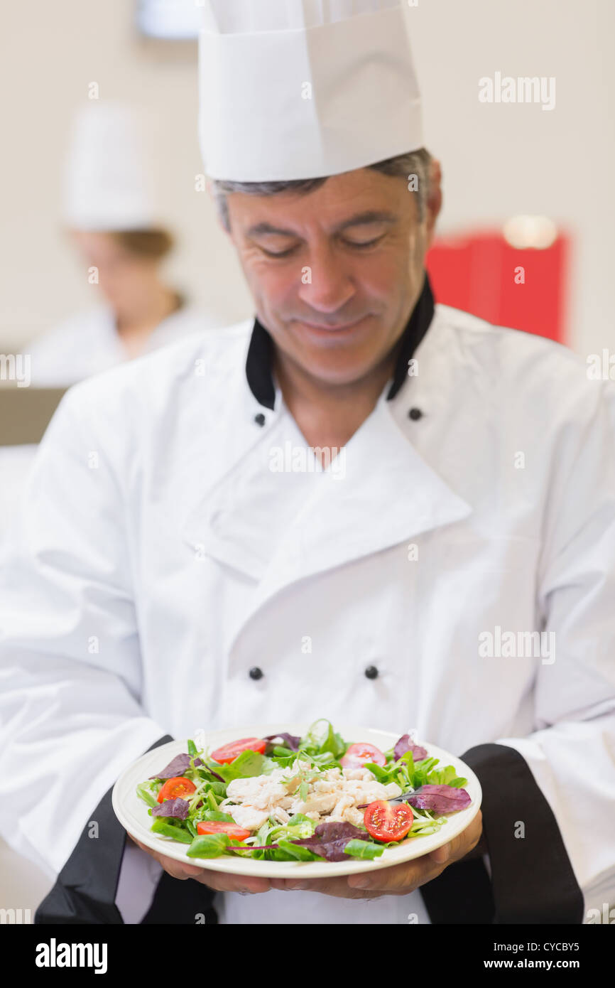 Chef looking at his salad Stock Photo - Alamy