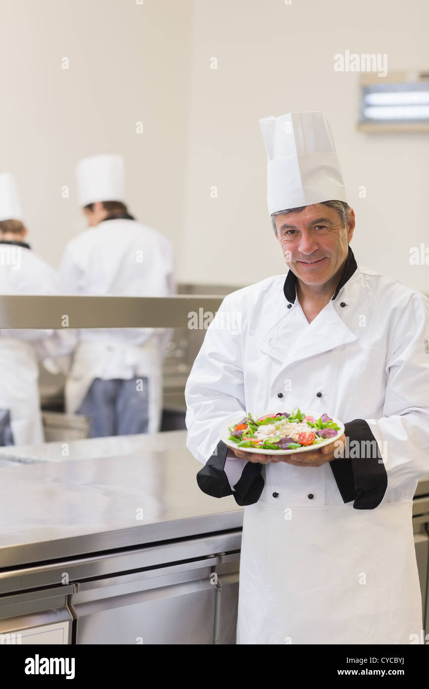 Chef showing his salad in the kitchen Stock Photo - Alamy