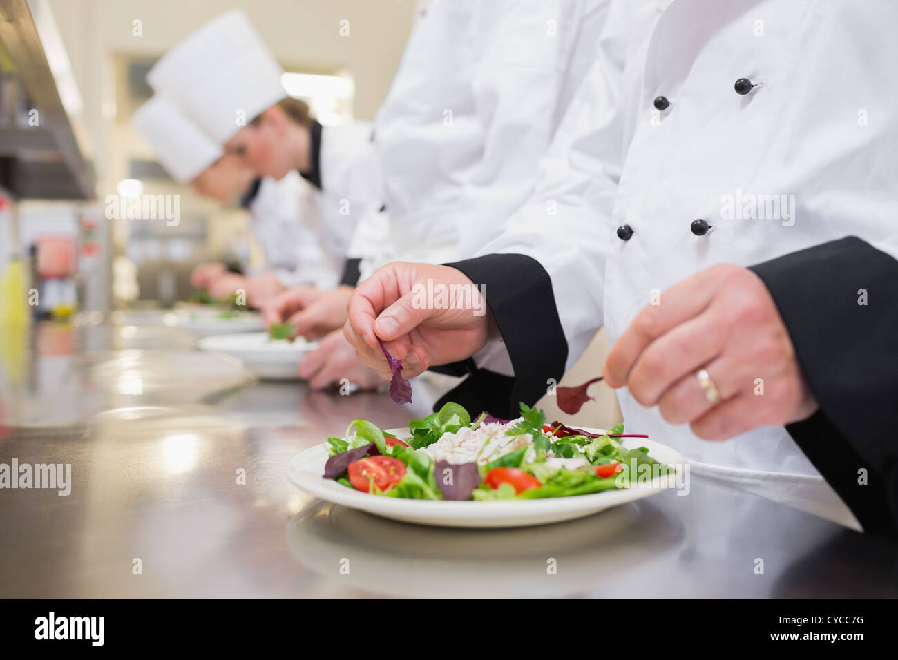 Chef garnishing salads Stock Photo - Alamy