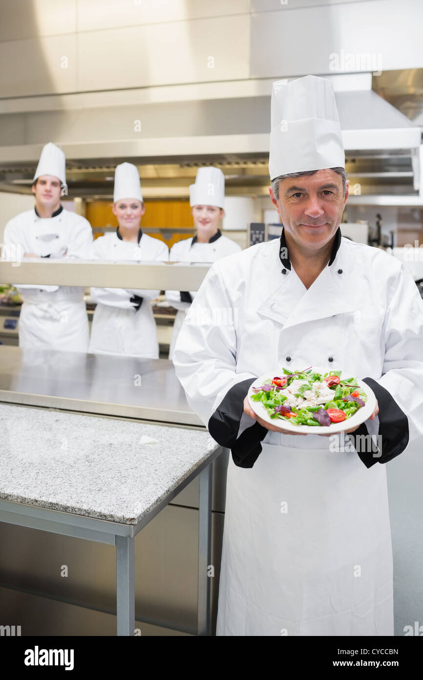 Head chef showing a salad Stock Photo - Alamy