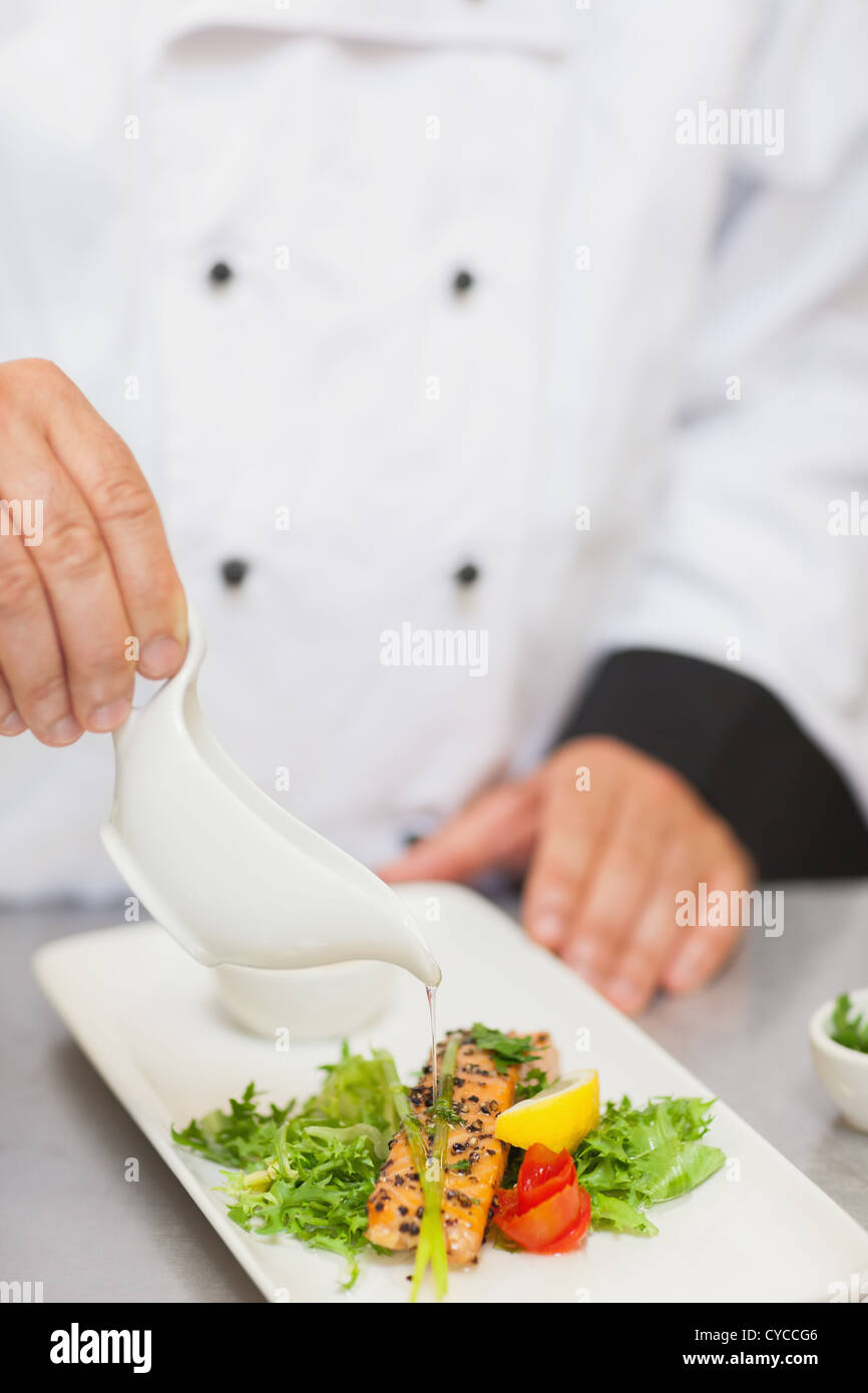 Chef pouring sauce hi-res stock photography and images - Alamy