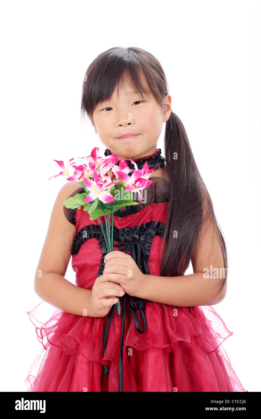 Little asian girl holding a flower on white background Stock Photo - Alamy