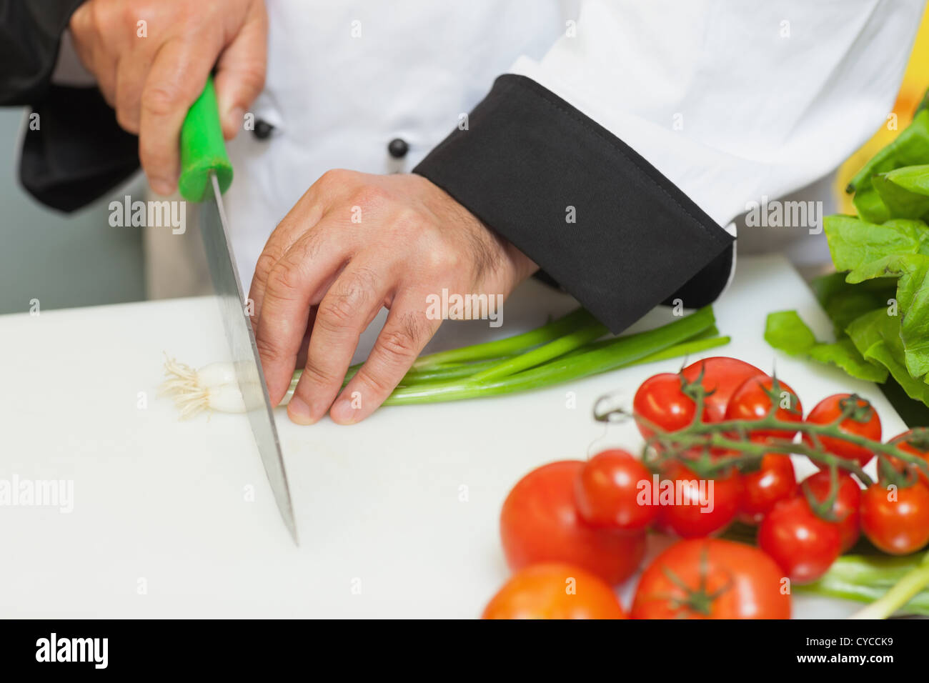 Chef cutting spring onions Stock Photo - Alamy