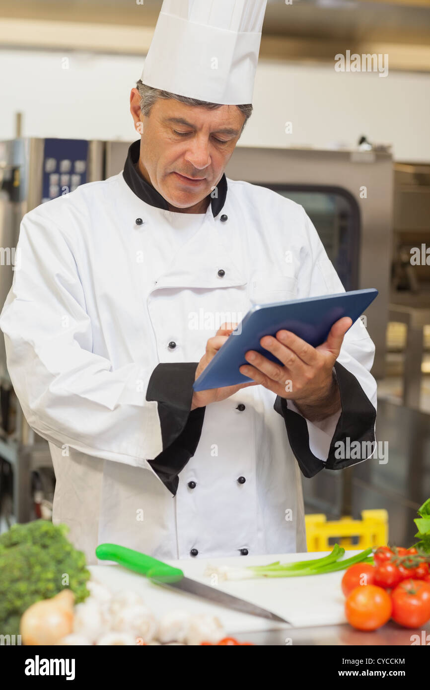 Chef using digital tablet Stock Photo - Alamy