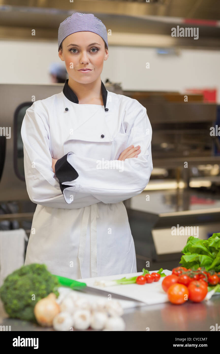 Chef standing beside chopping board and vegetables Stock Photo - Alamy