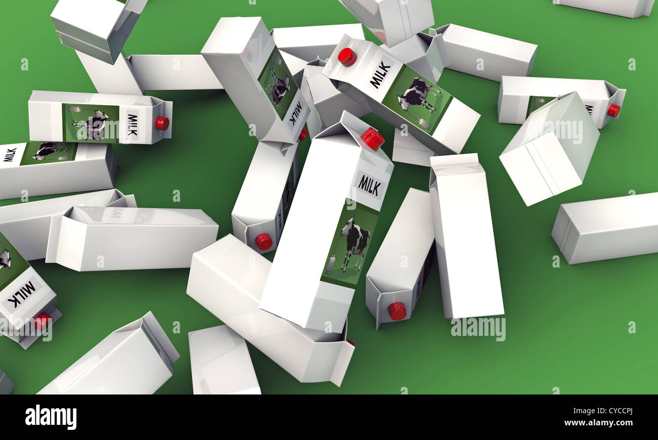 milk packages falling down on green background Stock Photo - Alamy