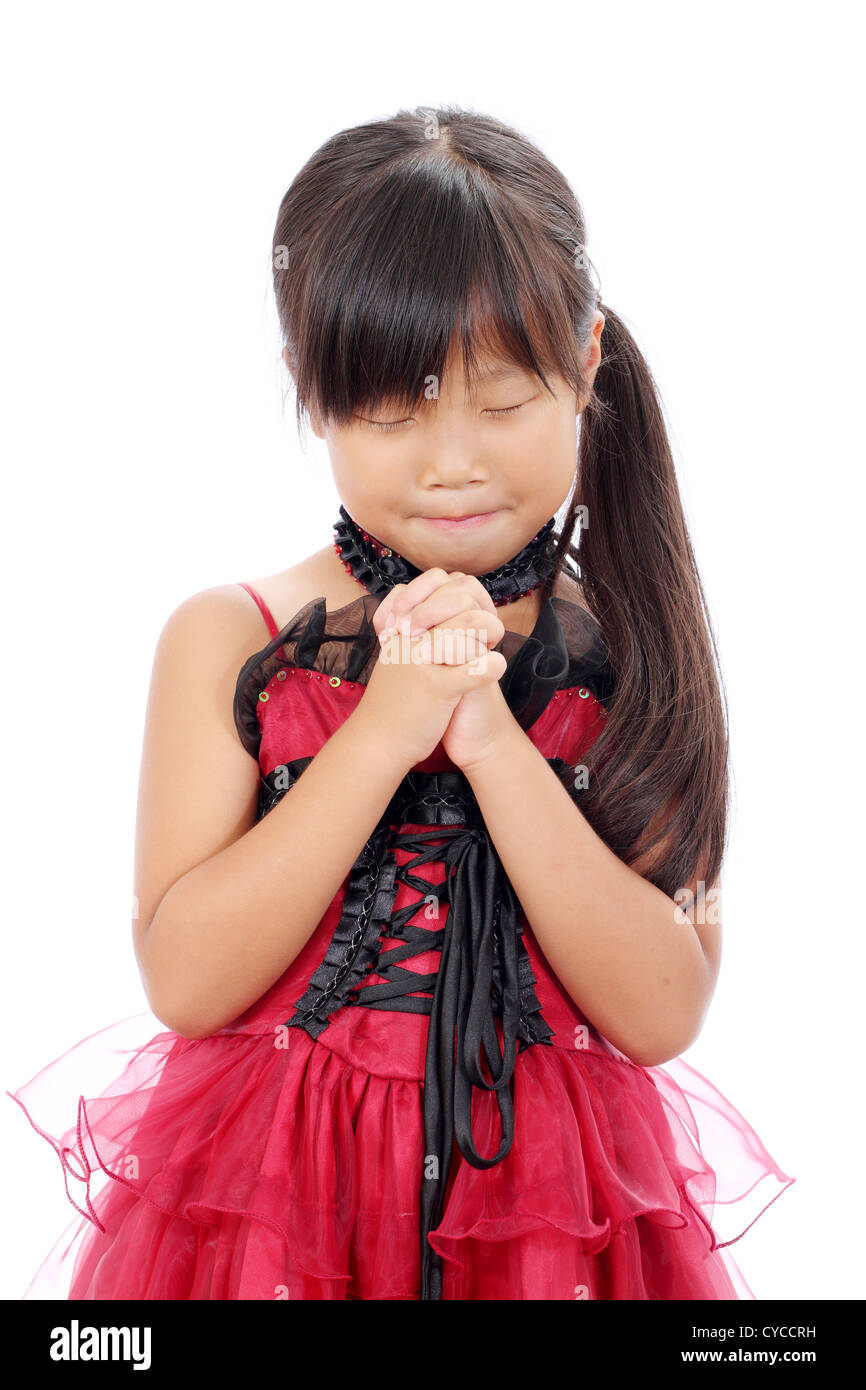 Studio photo of little asian girl praying Stock Photo - Alamy