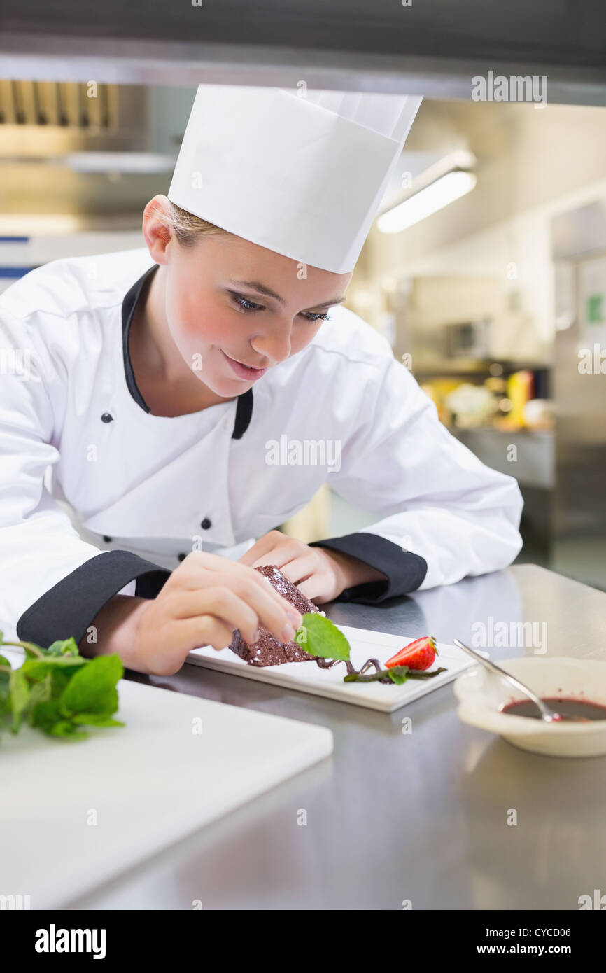 Chef putting mint on her plate Stock Photo - Alamy