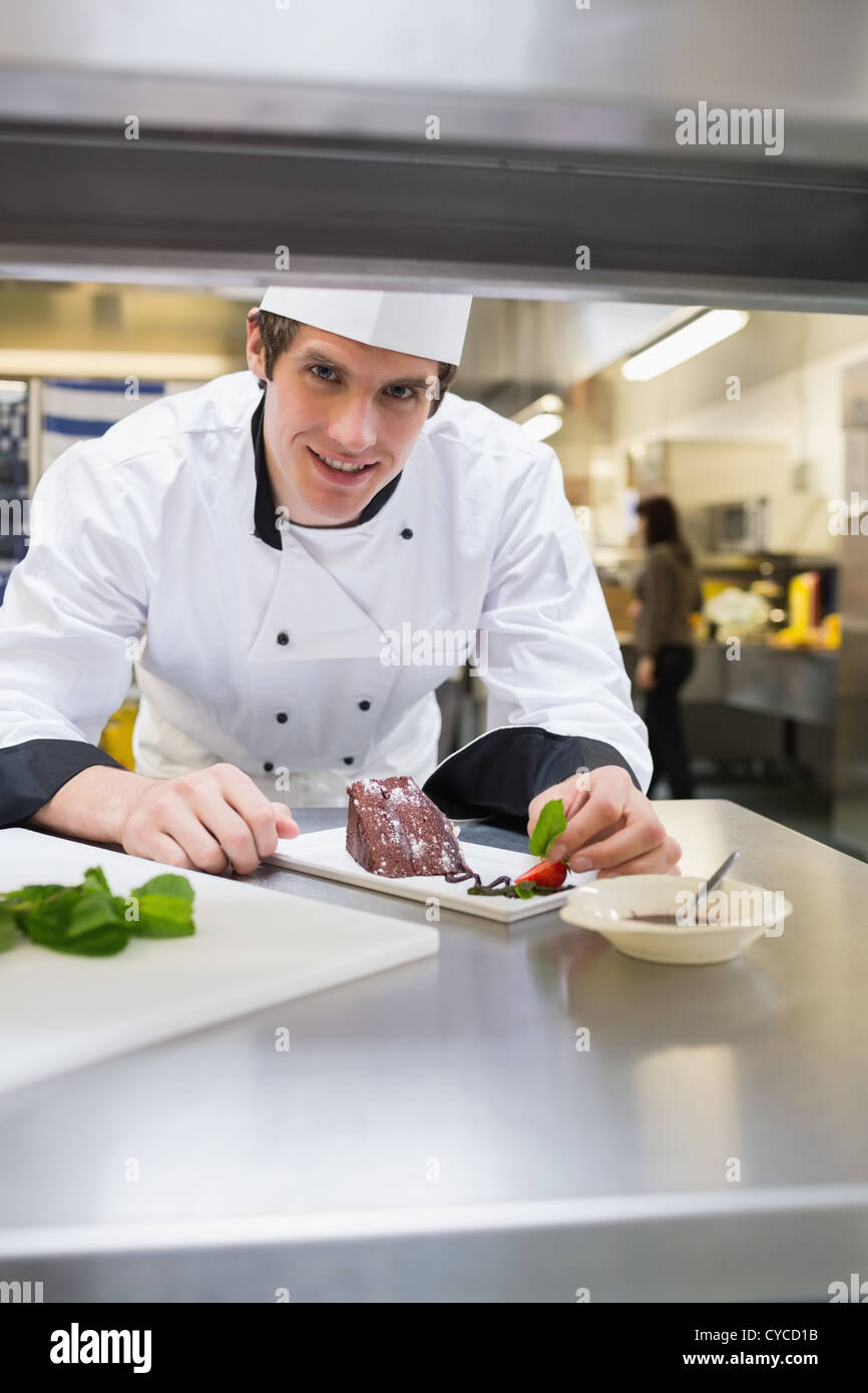 Chef putting mint on his plate Stock Photo - Alamy