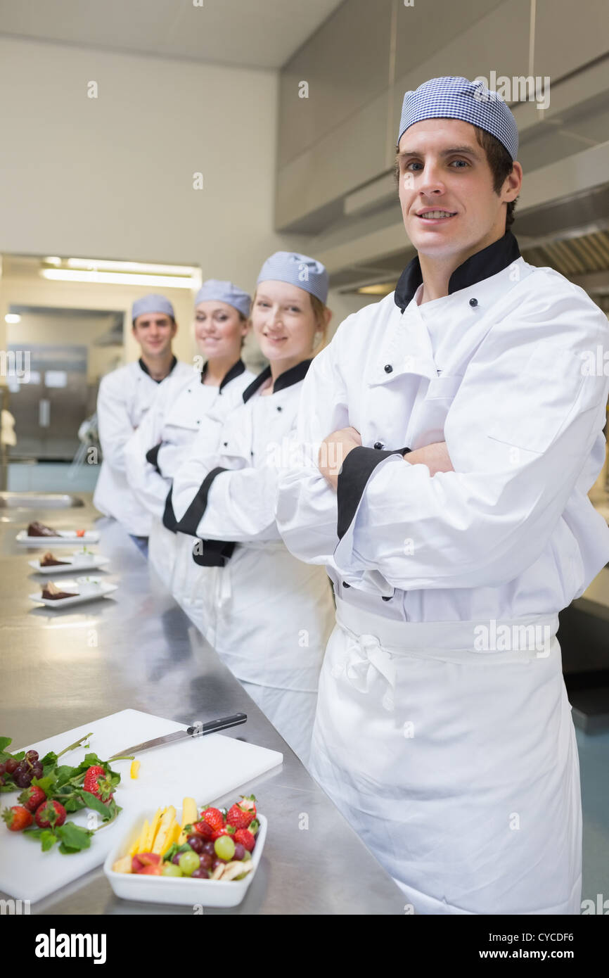 Team of Chef's standing in the kitchen Stock Photo - Alamy