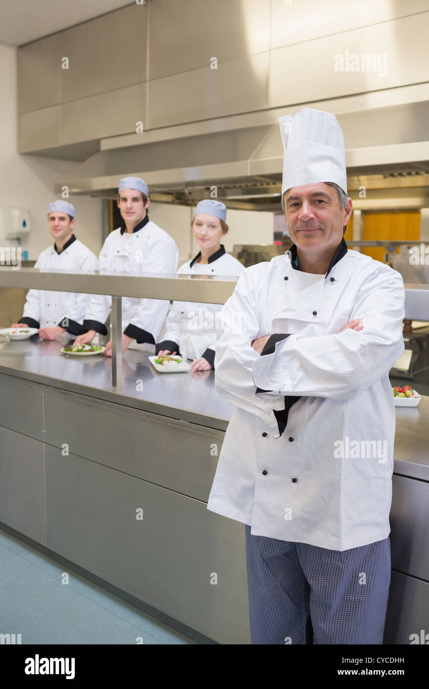 Head chef standing with arms crossed Stock Photo - Alamy