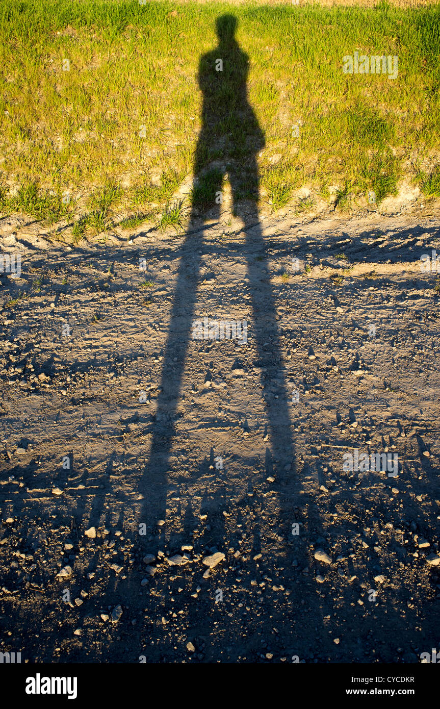 shadow of person in field Stock Photo - Alamy
