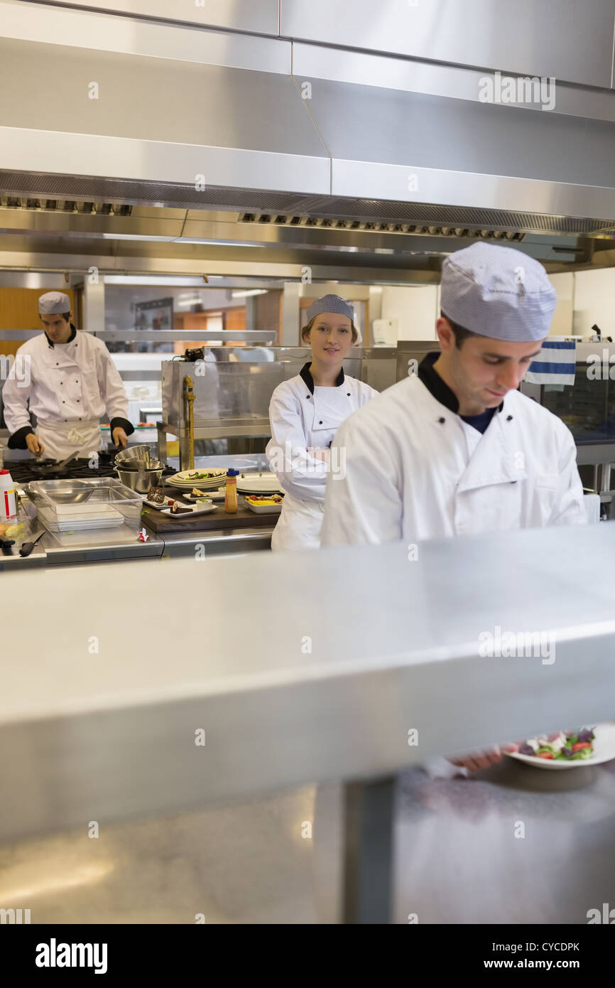 Three Chef's cooking Stock Photo - Alamy
