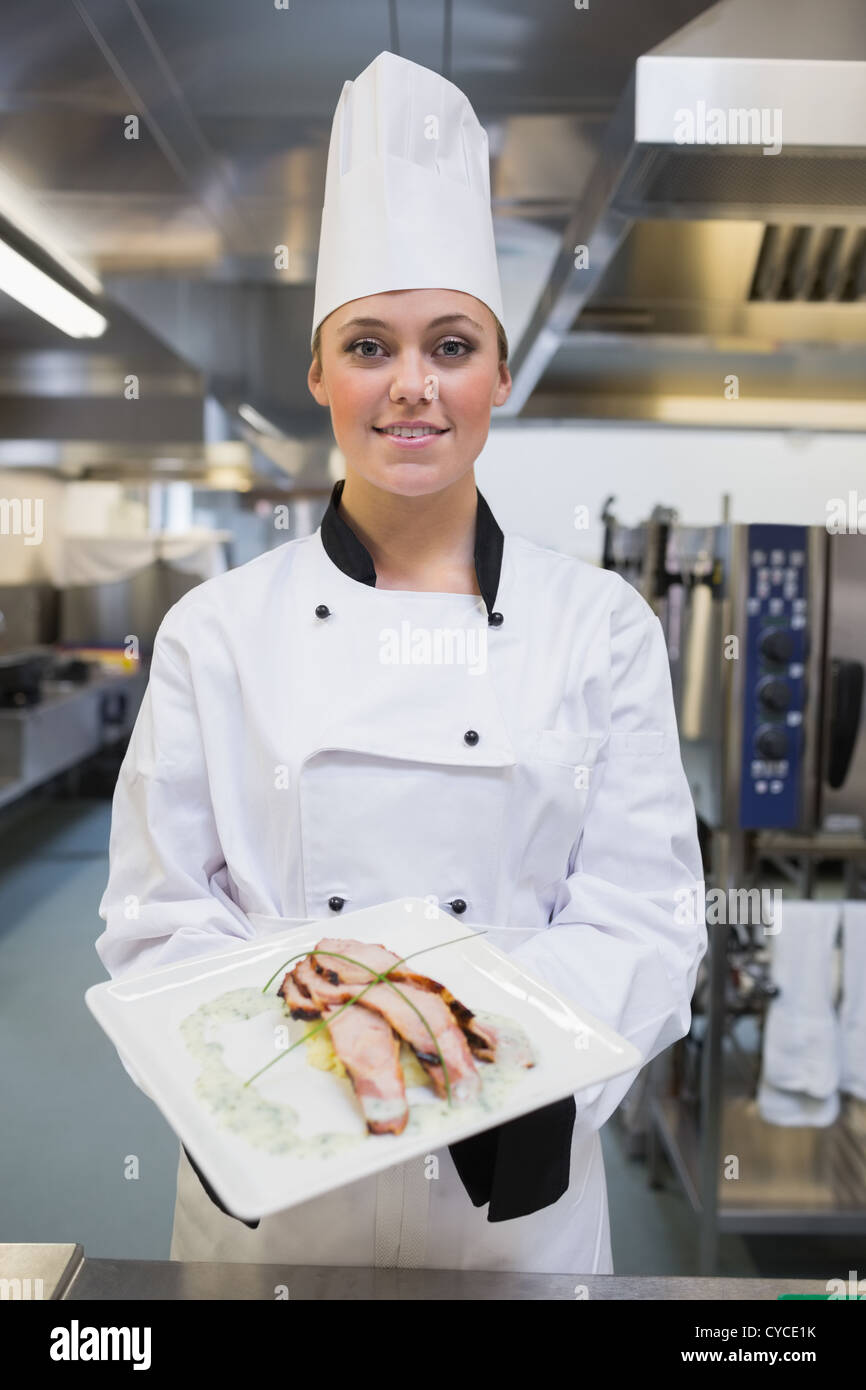 Smiling chef showing her plate Stock Photo - Alamy