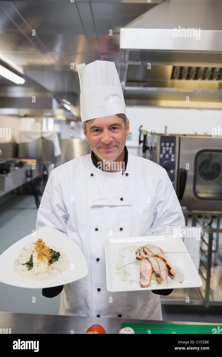 Chef presenting two dishes Stock Photo - Alamy