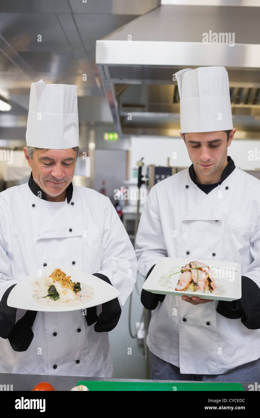 Two chefs presenting dishes hi-res stock photography and images - Alamy