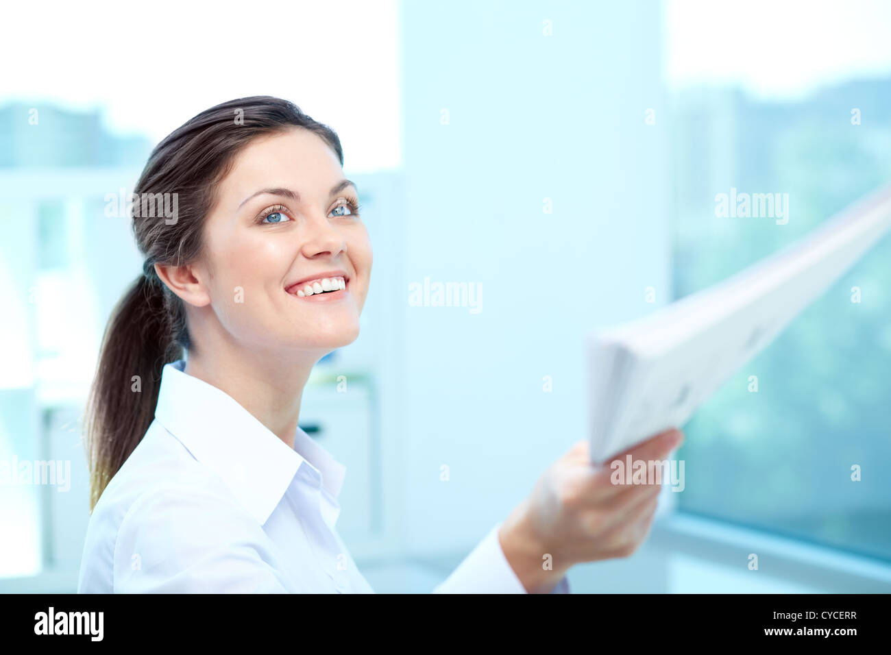 Portrait of young female giving application to conductor Stock Photo ...