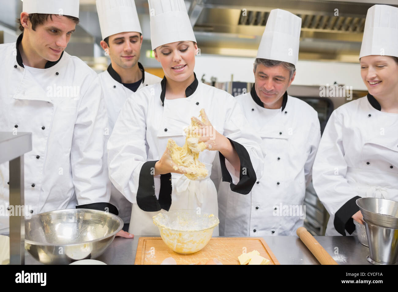 Class watching pastry teacher forming the dough Stock Photo - Alamy
