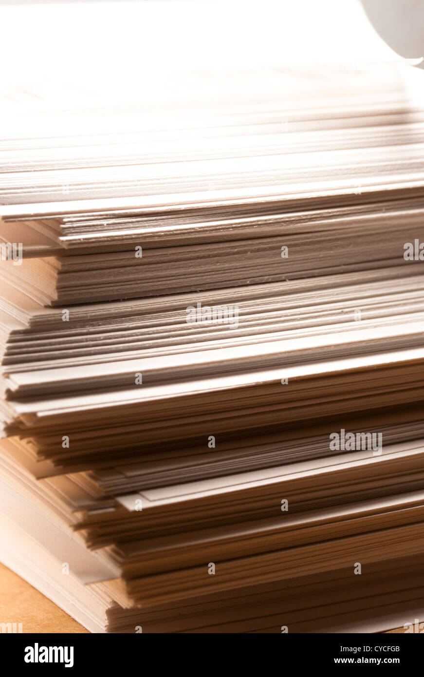 Stack of paper cards in yellow Stock Photo - Alamy