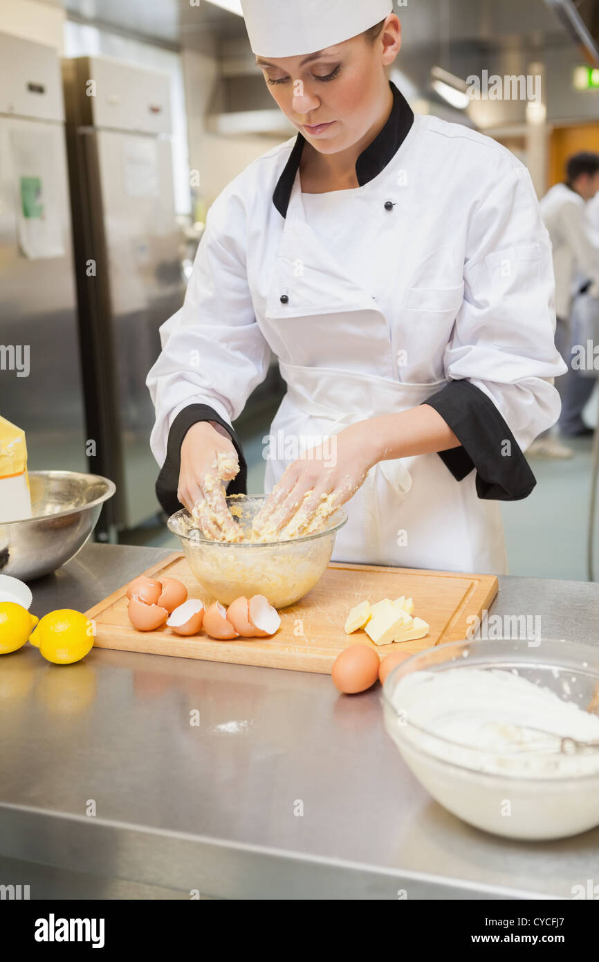Baker mixing dough Stock Photo - Alamy