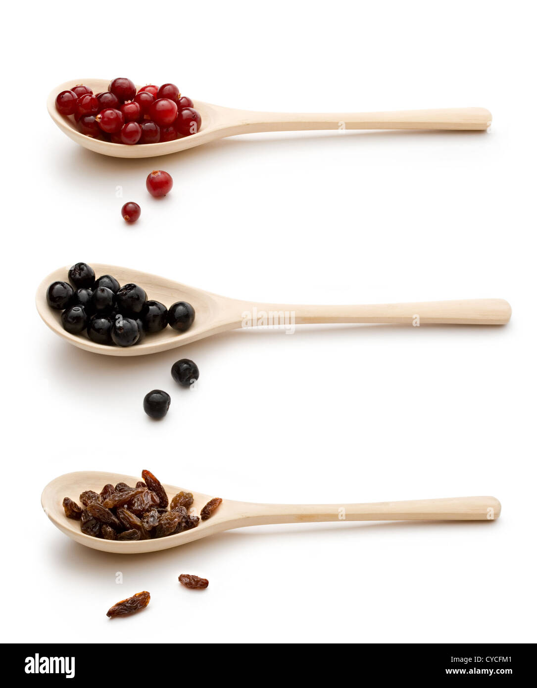 Three spoon with raisin, chokeberry and cranberries Stock Photo - Alamy