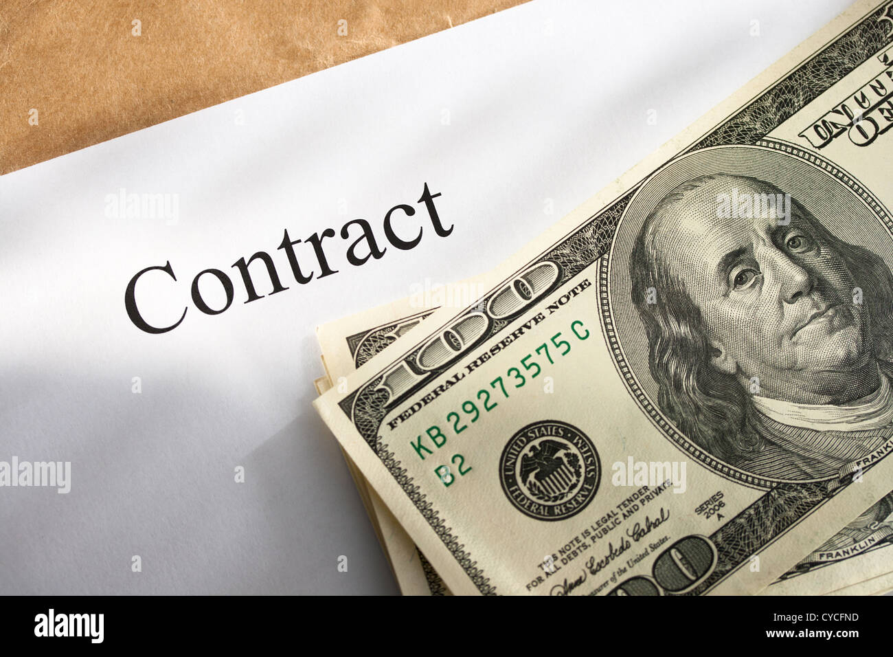 Contract conception with money Stock Photo - Alamy