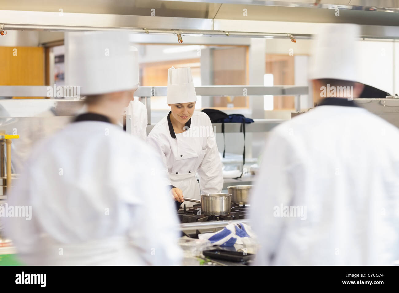 Chef working at the stove Stock Photo - Alamy