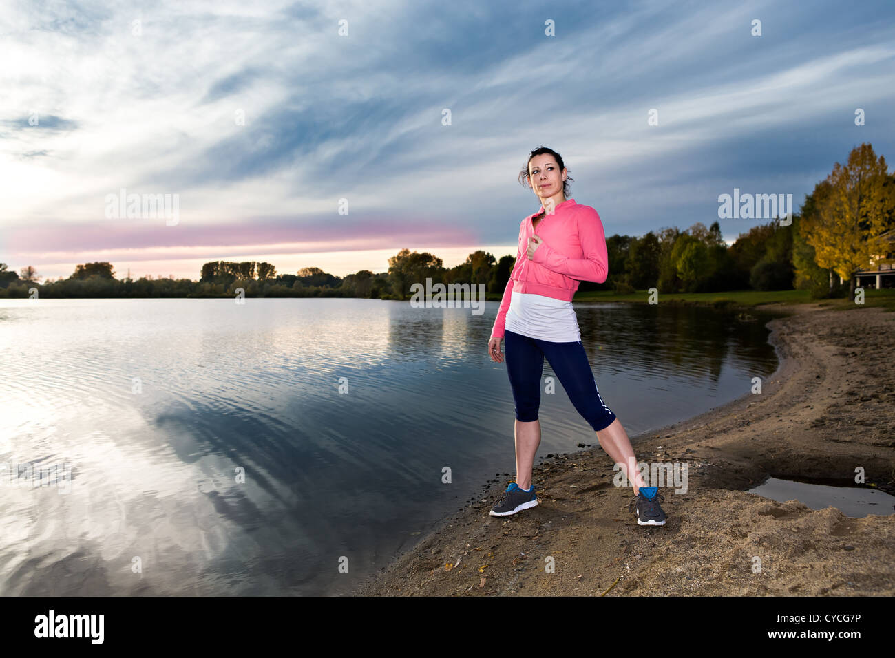 A woman taking a break at lake Stock Photo - Alamy