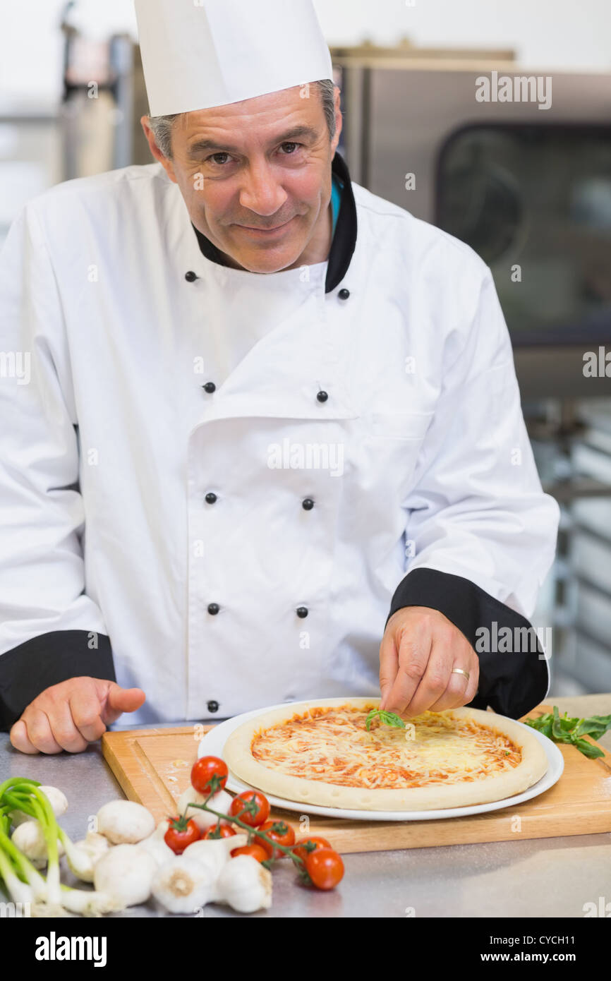 Finishing touch to food pizza hi-res stock photography and images - Alamy