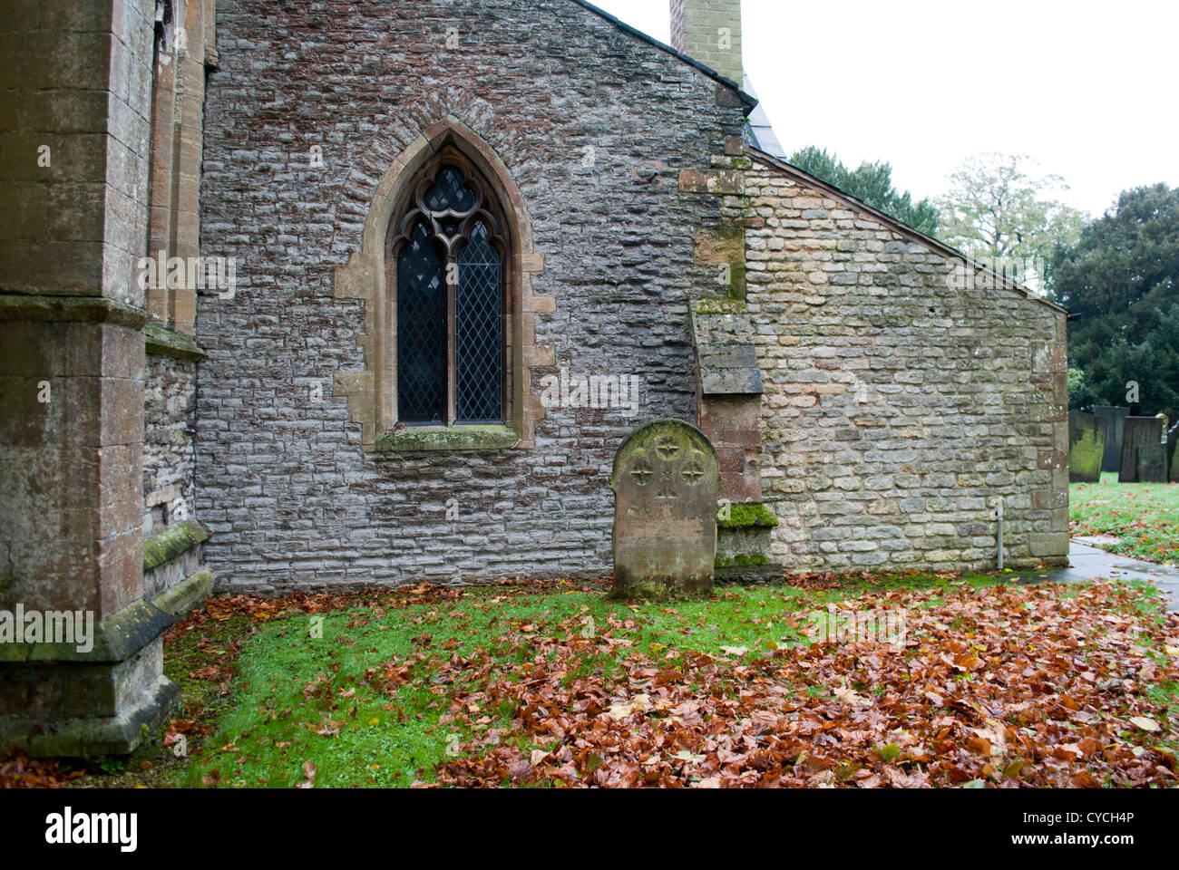 Side of Church of St. Mary and All Saints, Bingham with autumn leaves ...