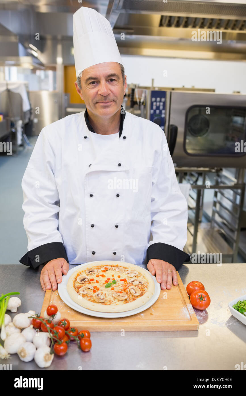 Chef with a pizza Stock Photo - Alamy
