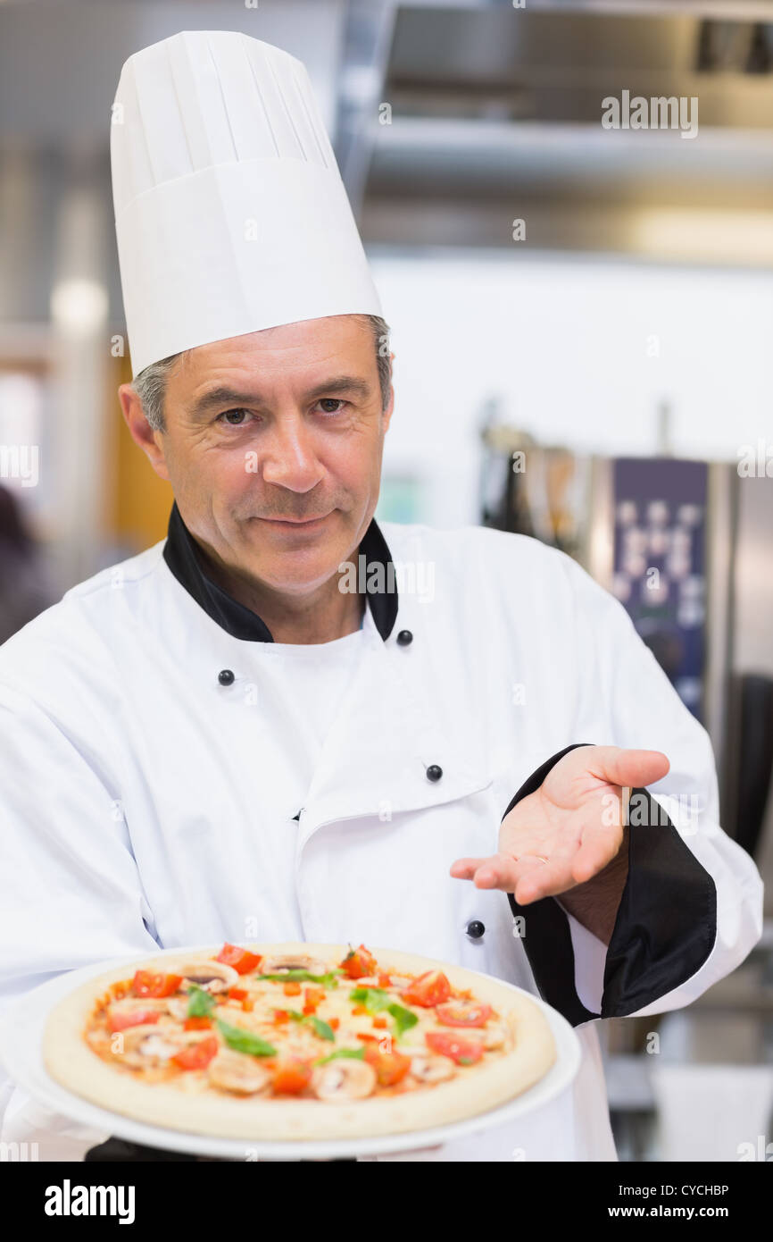 Proud chef showing his pizza Stock Photo - Alamy