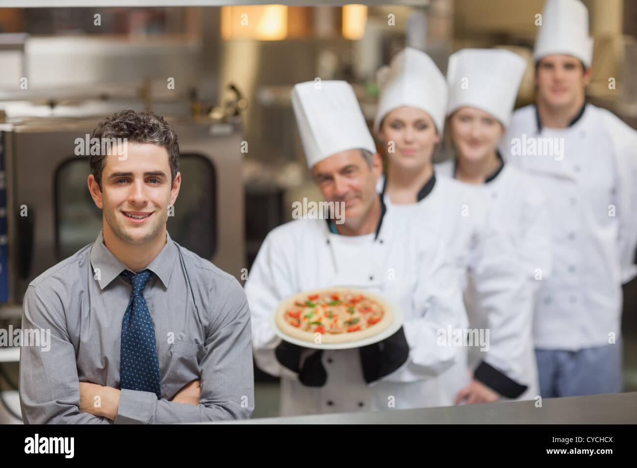 Waiter standing in front of Chef's Stock Photo - Alamy