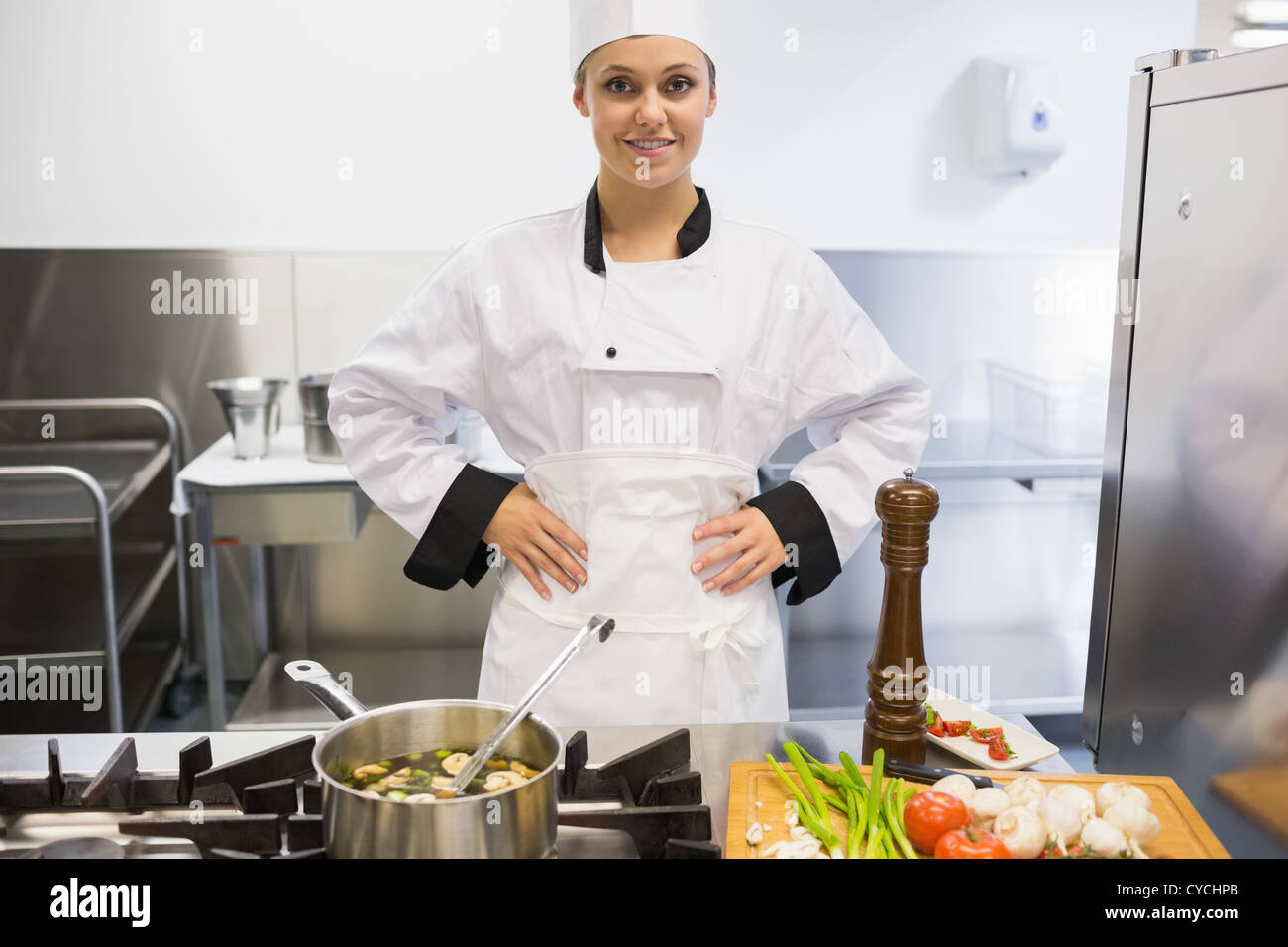 Chef standing at stove making soup Stock Photo - Alamy