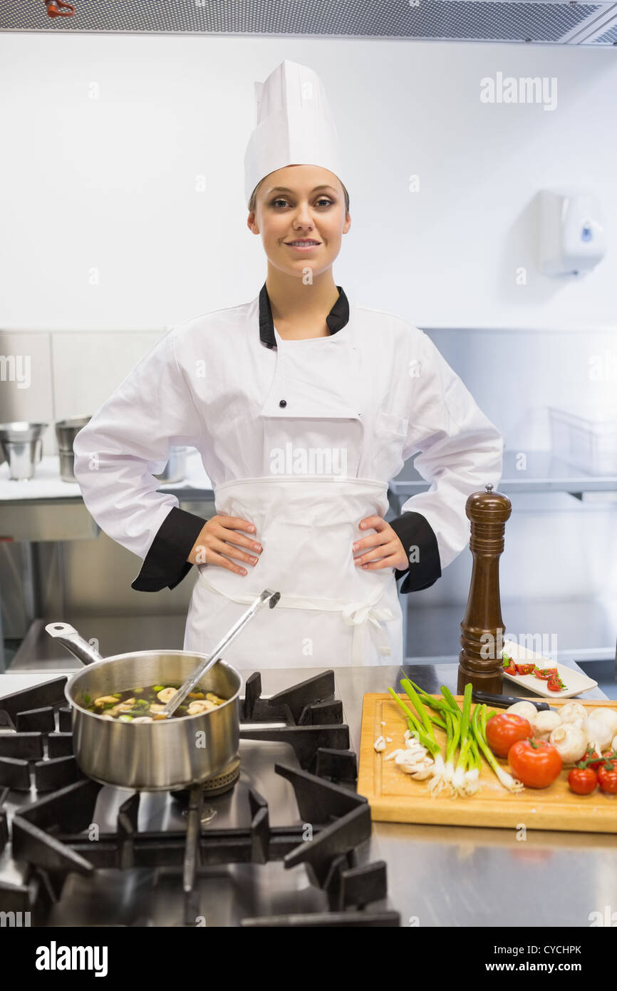 Chef smiling while cooking soup Stock Photo - Alamy