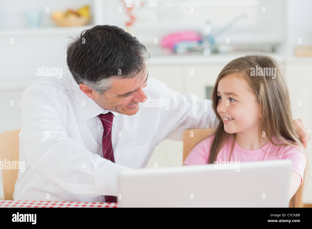 Father and daughter using laptop Stock Photo - Alamy
