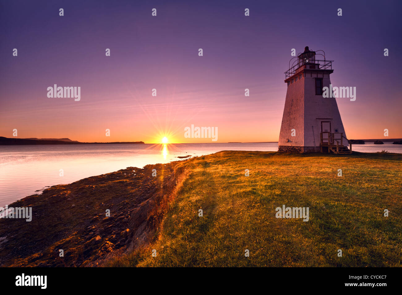 Lighthouse during sunrise in the early morning with beautiful colors ...