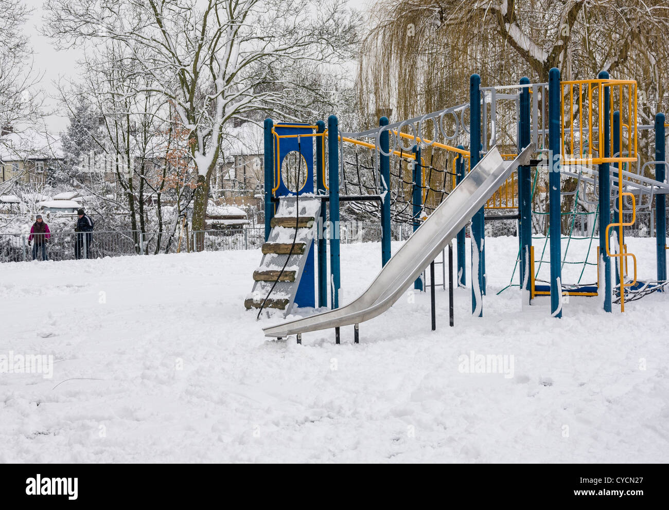 Empty children's playground after a heavy snowfall - Crane Park ...