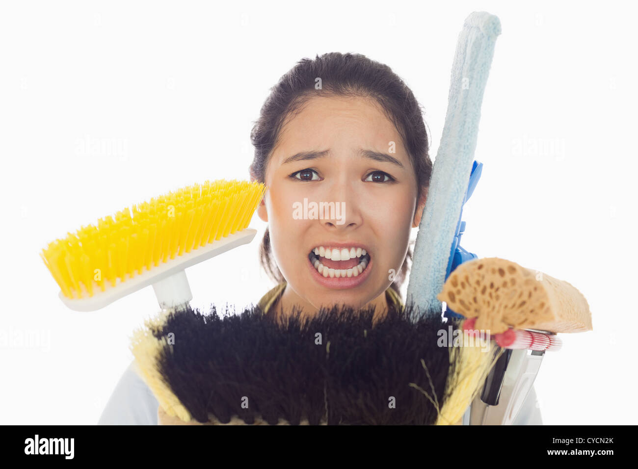 Very stressed woman with cleaning tools Stock Photo - Alamy