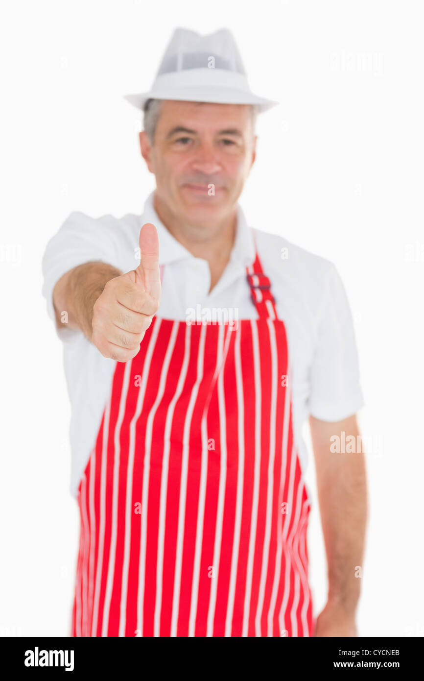 Happy butcher giving thumbs up Stock Photo - Alamy