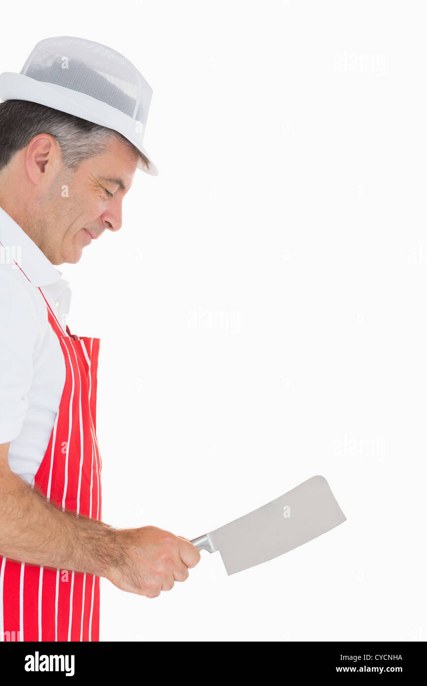 Butcher wielding meat cleaver Stock Photo - Alamy