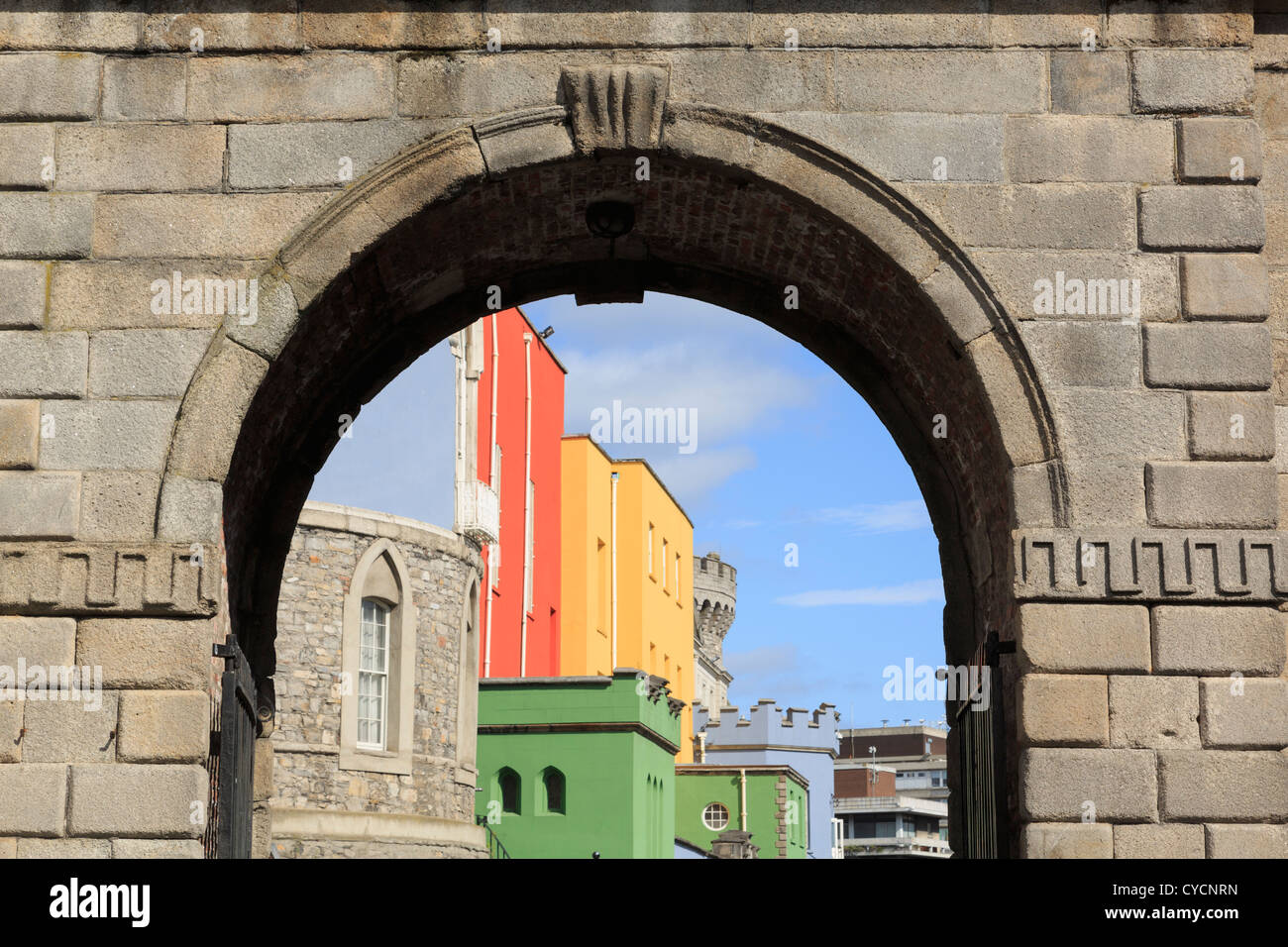 View through the arch gate in the walls to colourful Dublin castle ...
