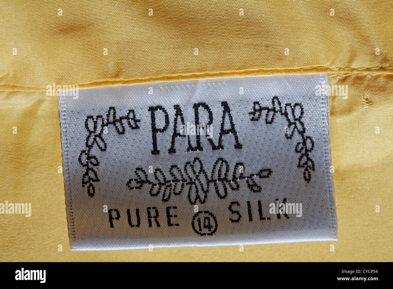 Para Pure Silk label in yellow coloured blouse Stock Photo - Alamy